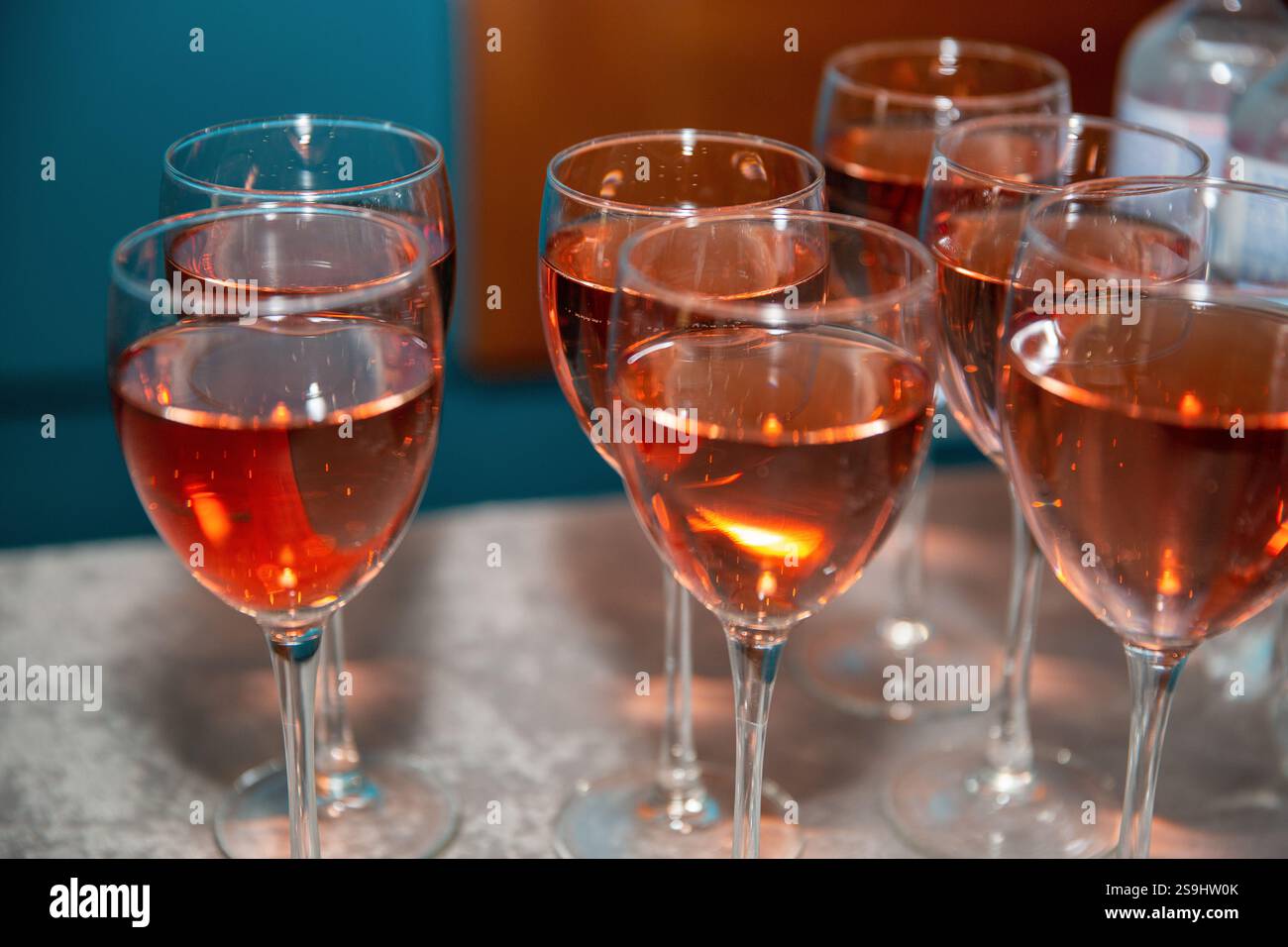 Glass goblets filled with rose wine during celebration closeup Stock ...