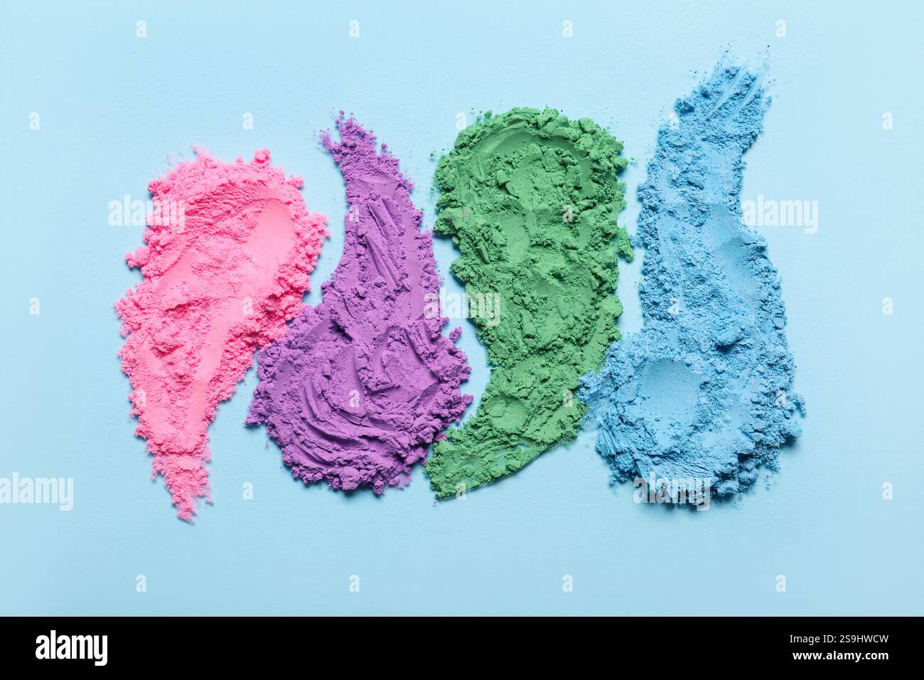 Powder pigments on blue background Stock Photo - Alamy