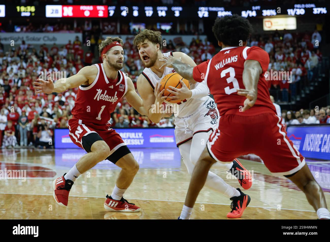 January 26, 2025: Wisconsin Badgers guard Max Klesmit (11) splits the ...