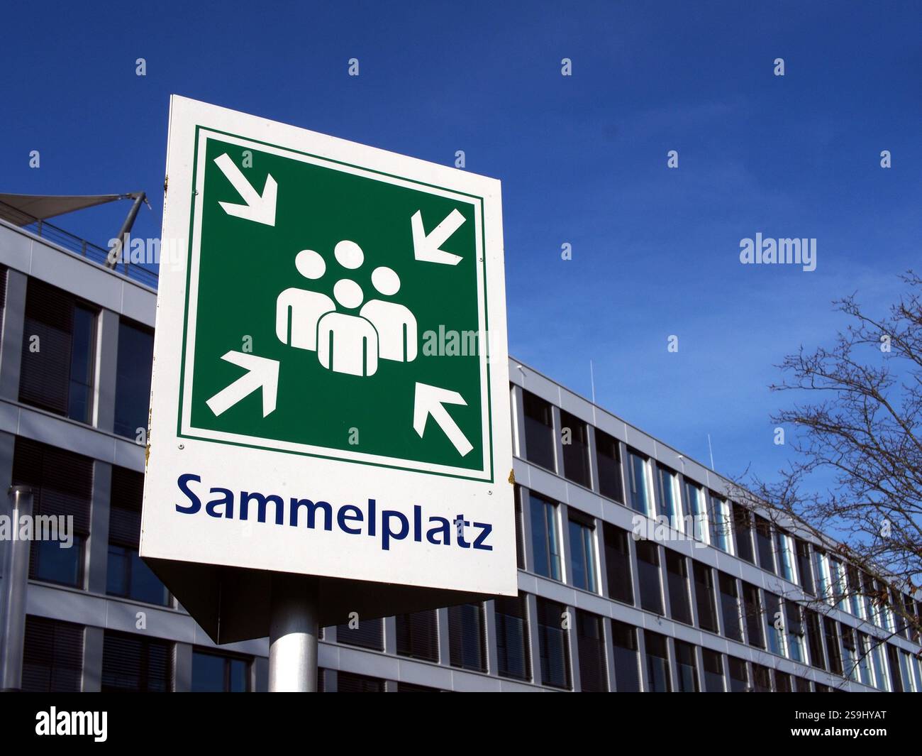 Sign “Sammelplatz” (assembly point) in front of an office building in ...