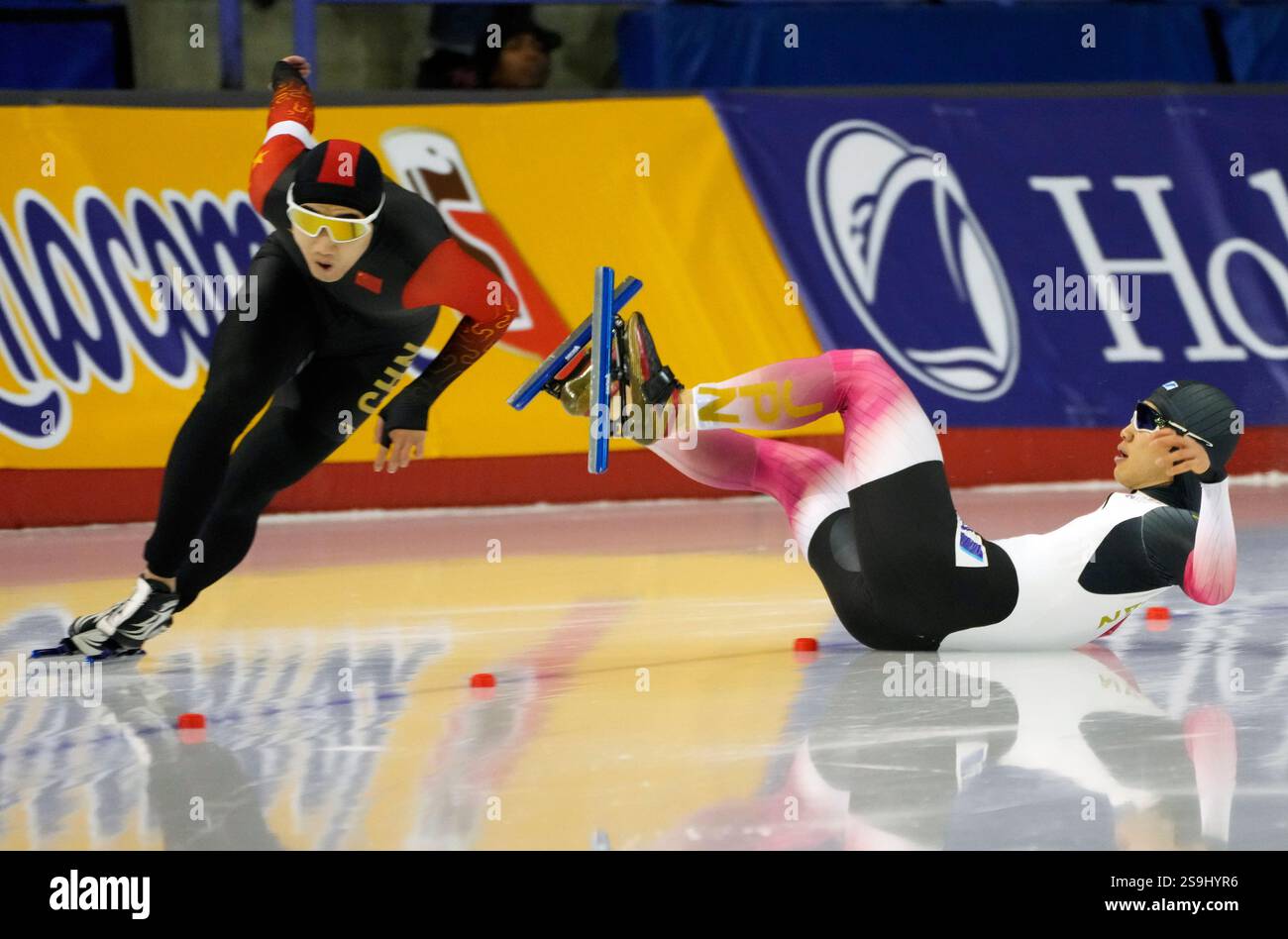 Chinese speed skater Tingyu Gao, left, just misses Japanese speed ...