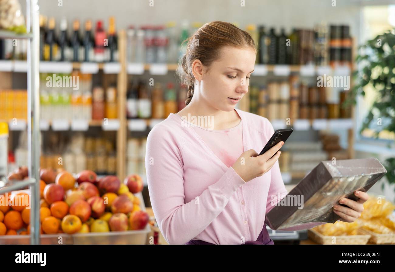 Young girl scanning qr code of cookie Stock Photo - Alamy