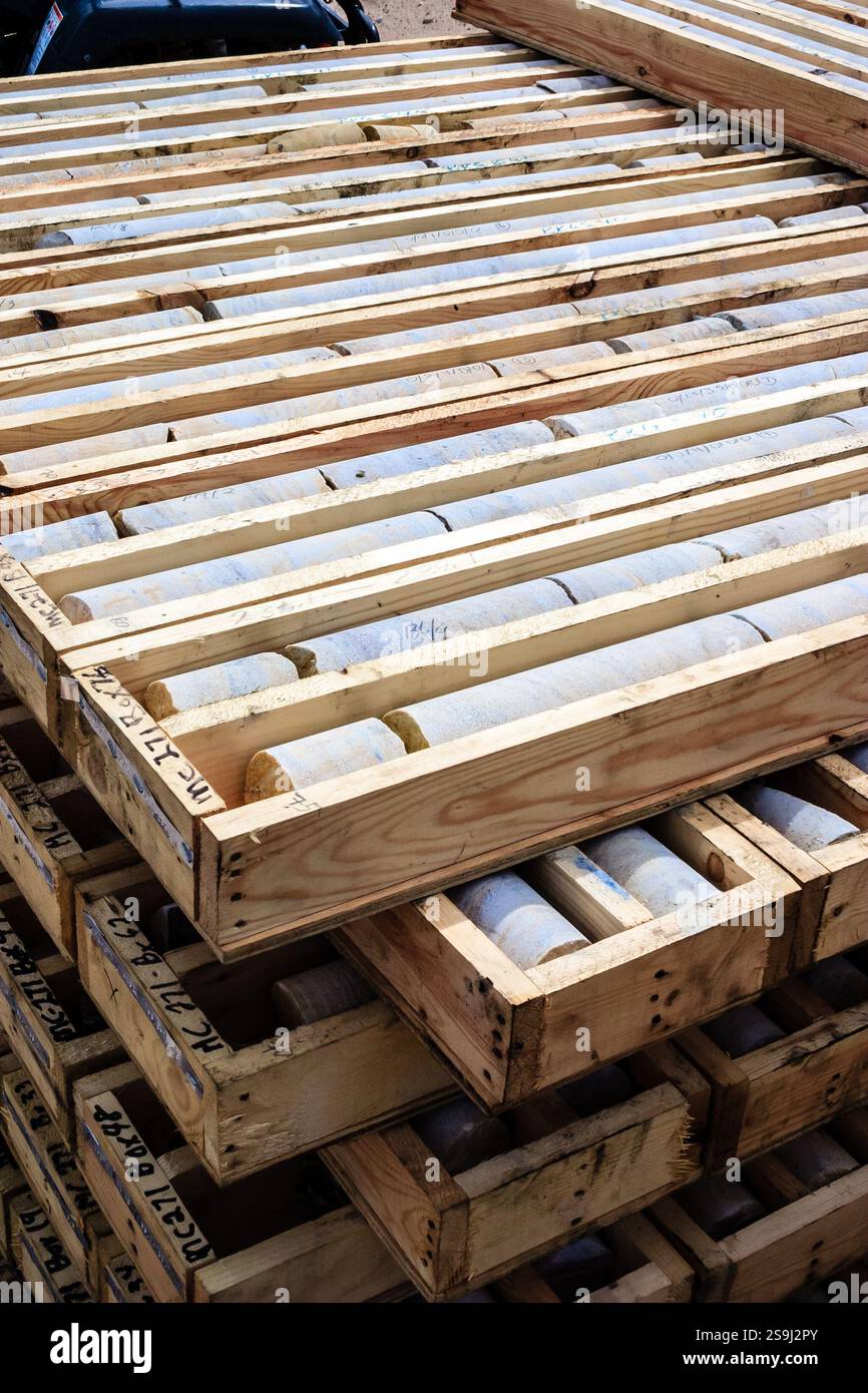 A stack of wooden crates with drill core rock in it. The crates are ...