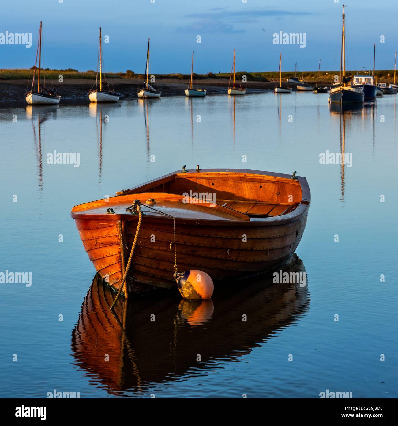 Boats moored in calm water at Burnham Overy Staithe Stock Photo - Alamy