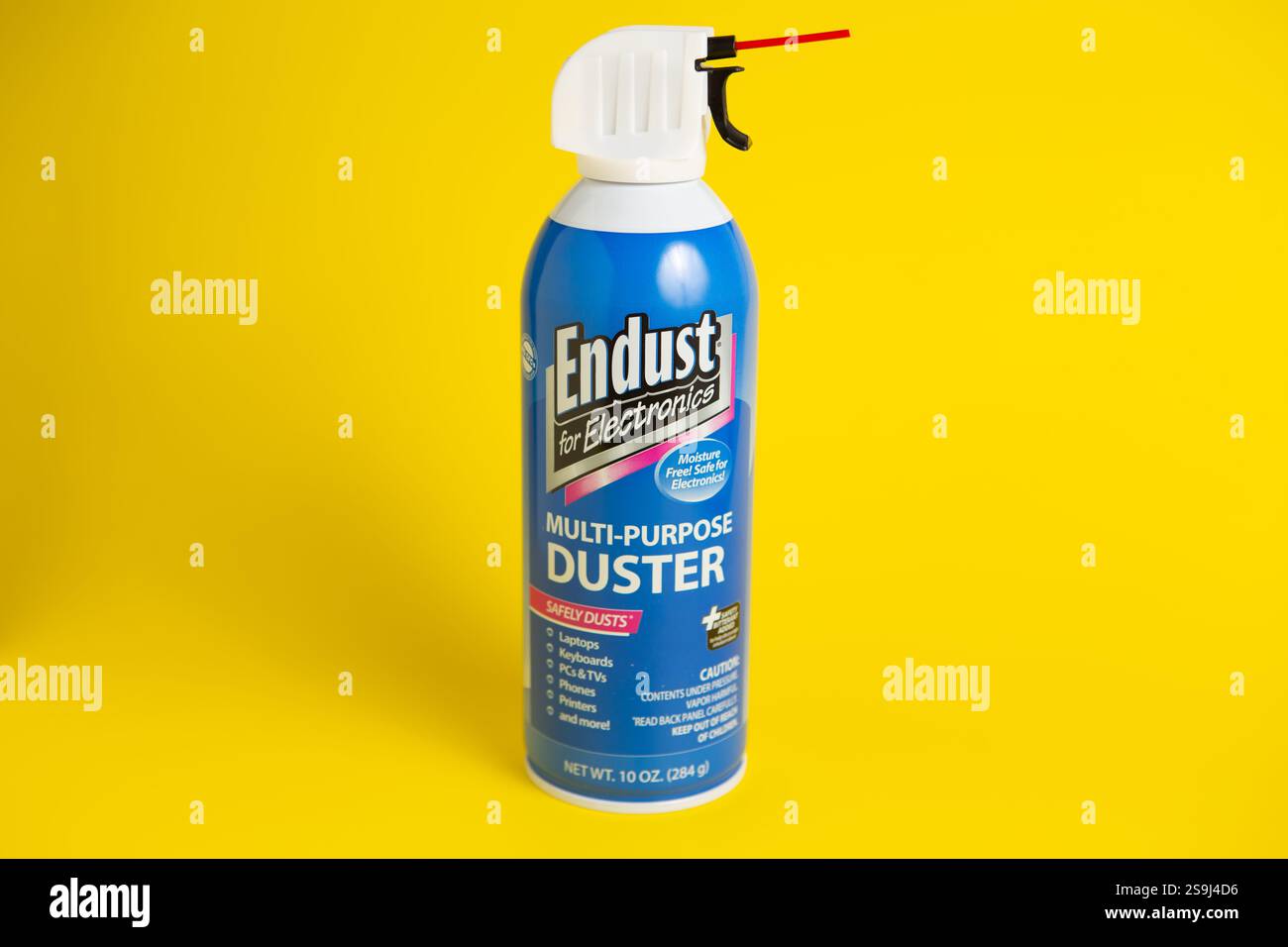 Endust compressed air multi purpose container with a yellow background ...
