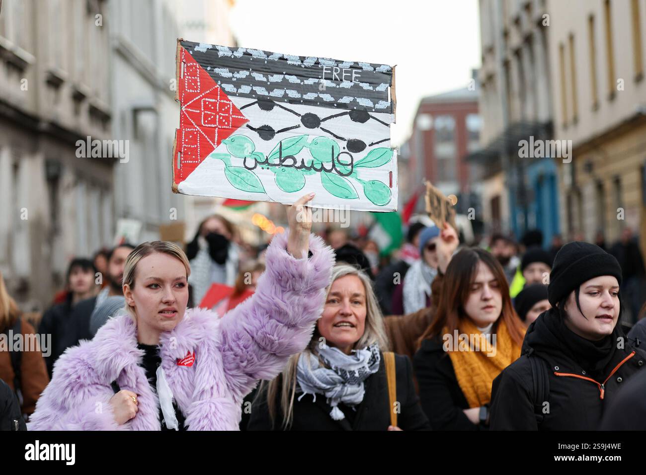 A Pro-Palestinian protester marches with a placard expressing her ...