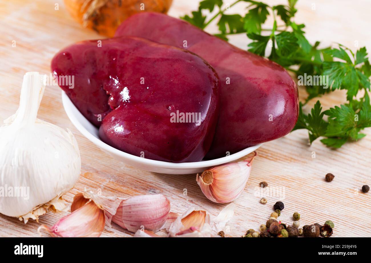 Raw pork kidneys Stock Photo - Alamy