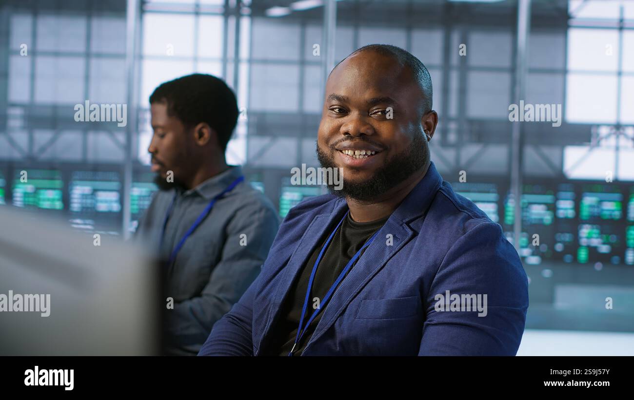 Cheerful data center engineers hi-res stock photography and images - Alamy