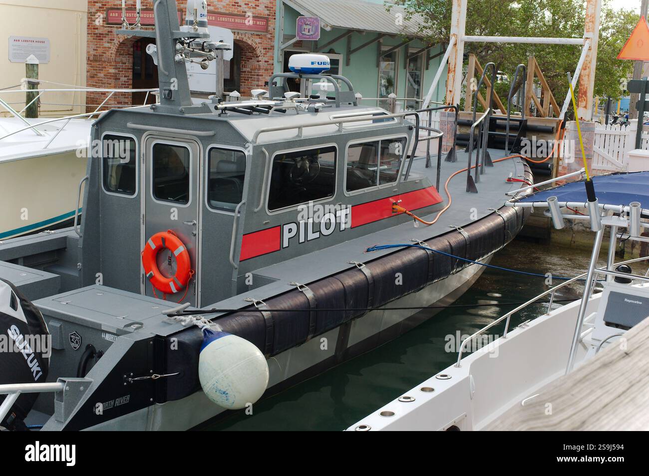 Red and gray Pilot Boat docked in Located in Key West's Historic ...
