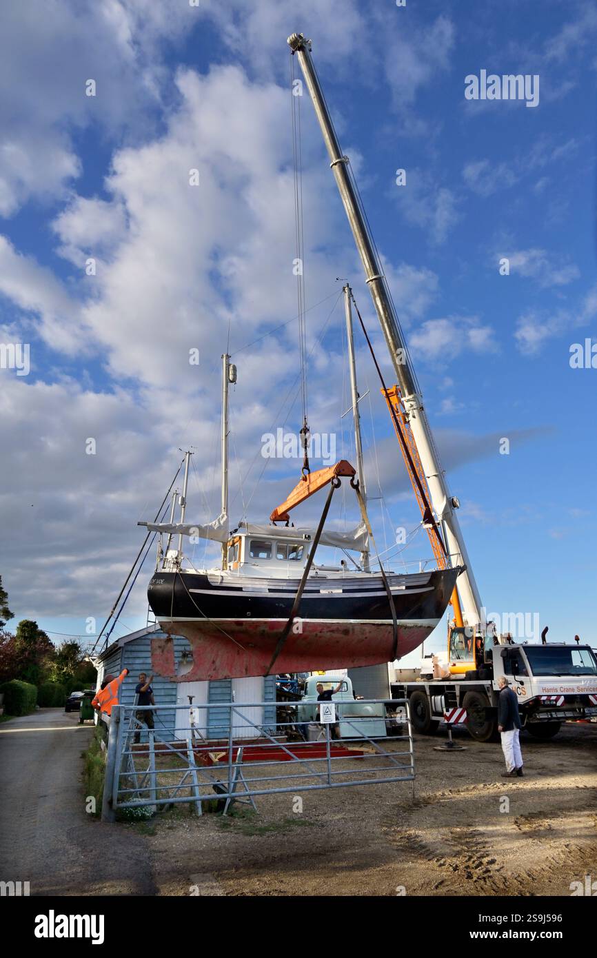 lifting sailing boat with mobile crane out for winter storage at ...