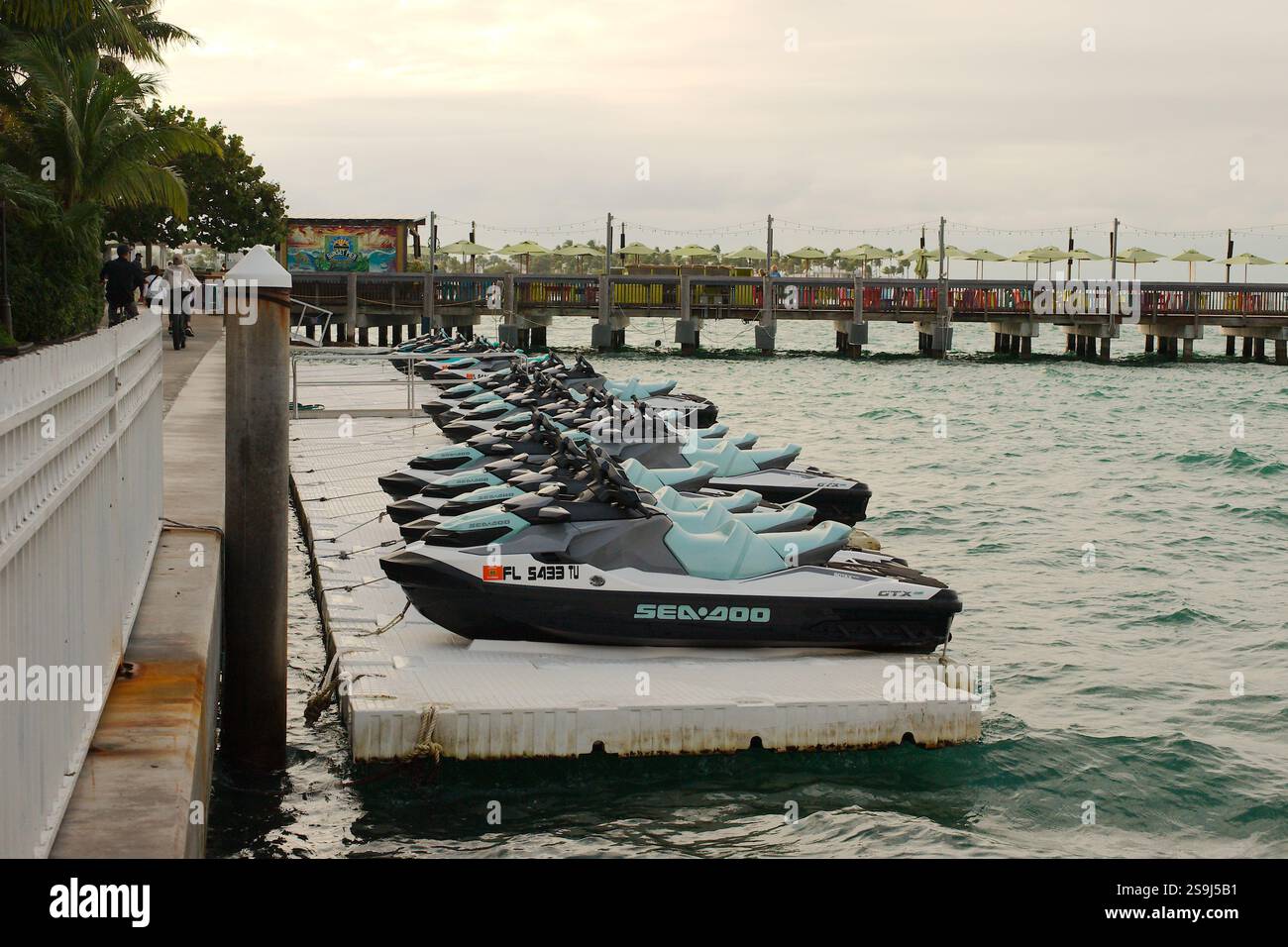 Leading line View of multiple jet skis parked in a marina on the left ...