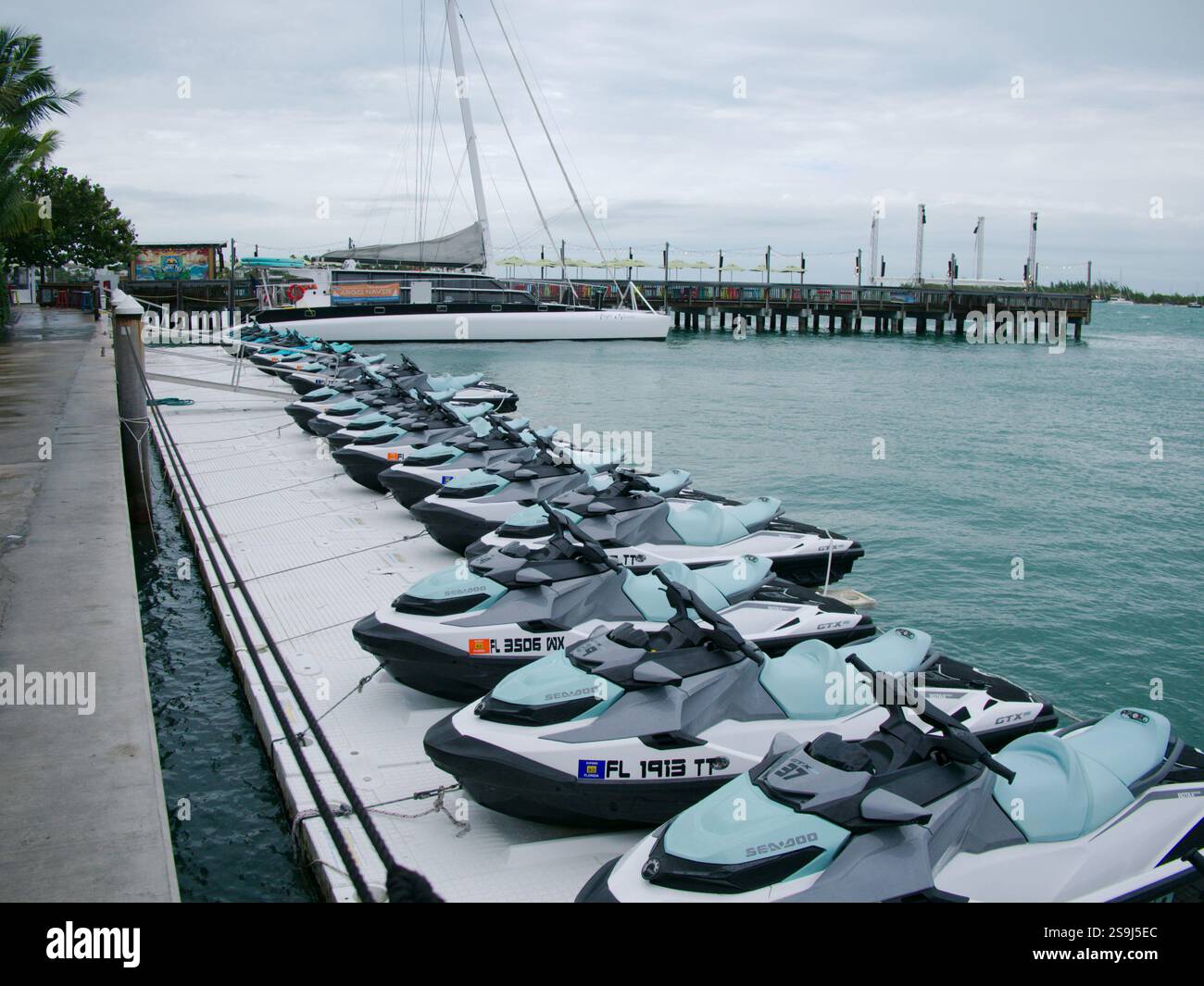 Leading line View of multiple jet skis parked in a marina on the left ...