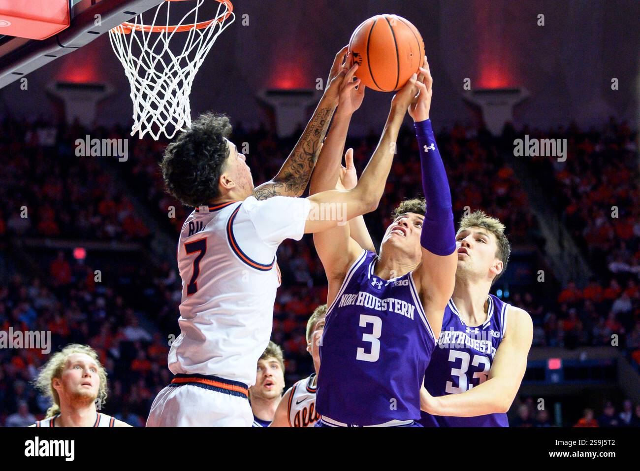 Illinois' Will Riley (7) fights for a rebound with Northwestern's Ty ...