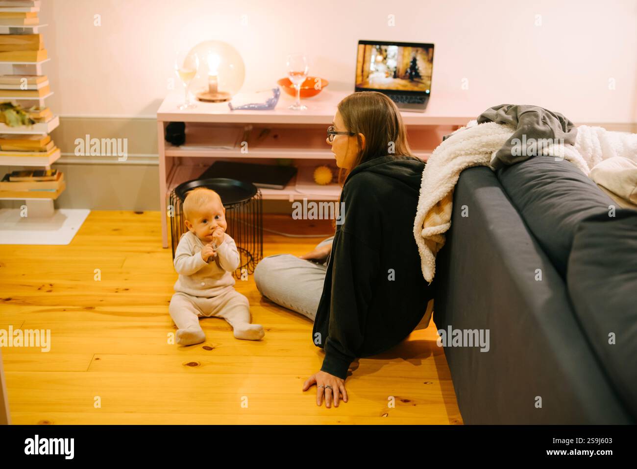 A Cozy Indoor Moment A Loving Parent and Their Baby Interacting ...