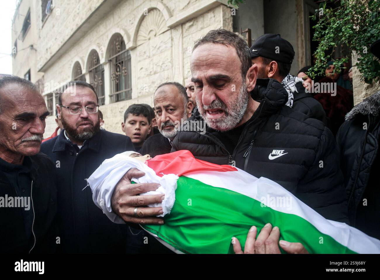 (EDITORS NOTE: Image depicts death)Palestinians and relatives of the ...