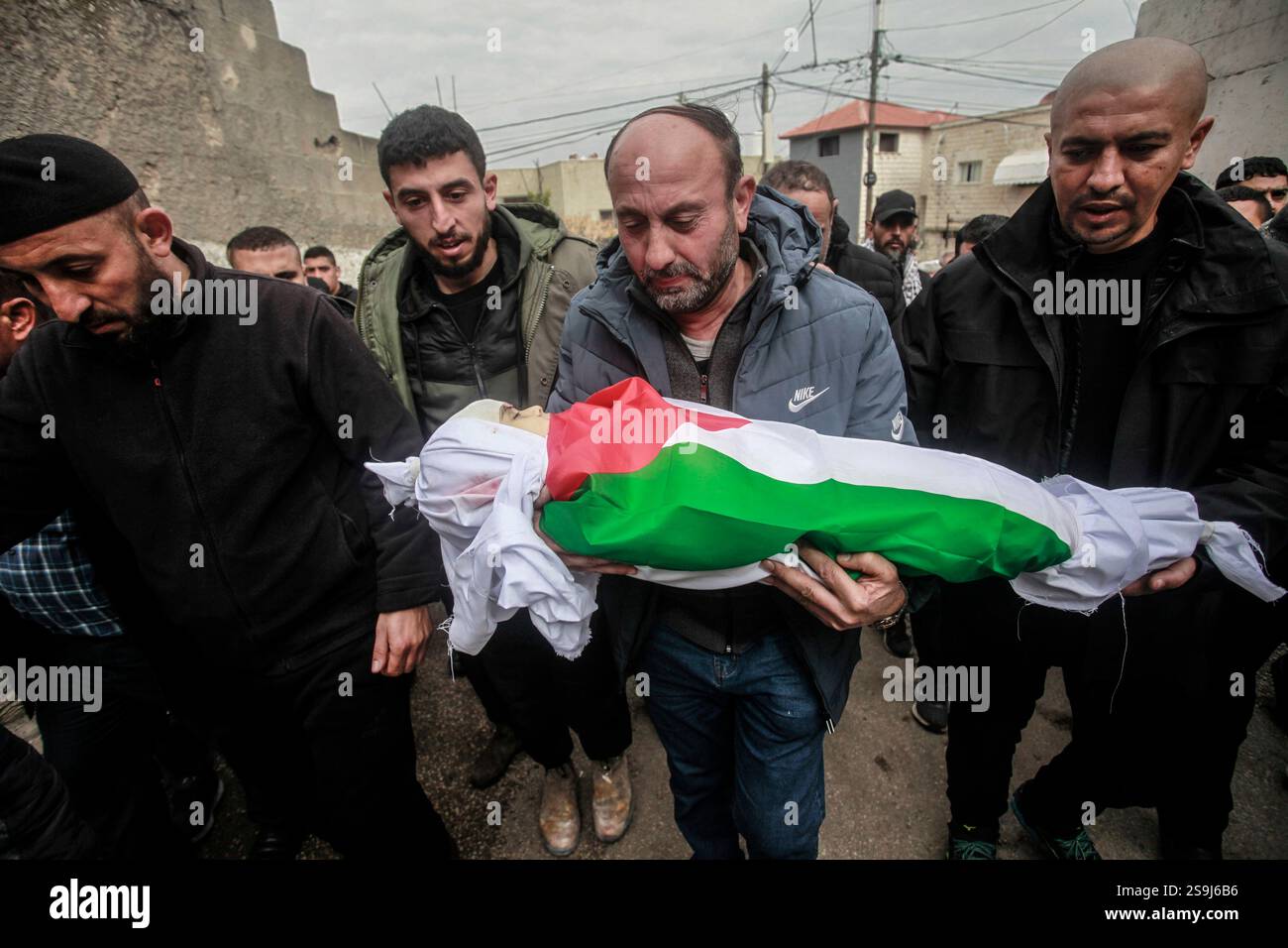 (EDITORS NOTE: Image depicts death)Palestinians and relatives of the ...