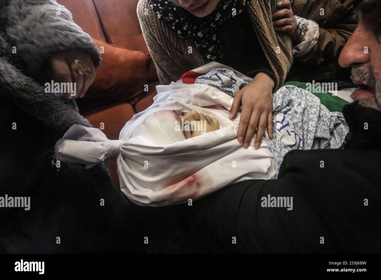 (EDITORS NOTE: Image depicts death)Palestinian relatives mourn near the ...
