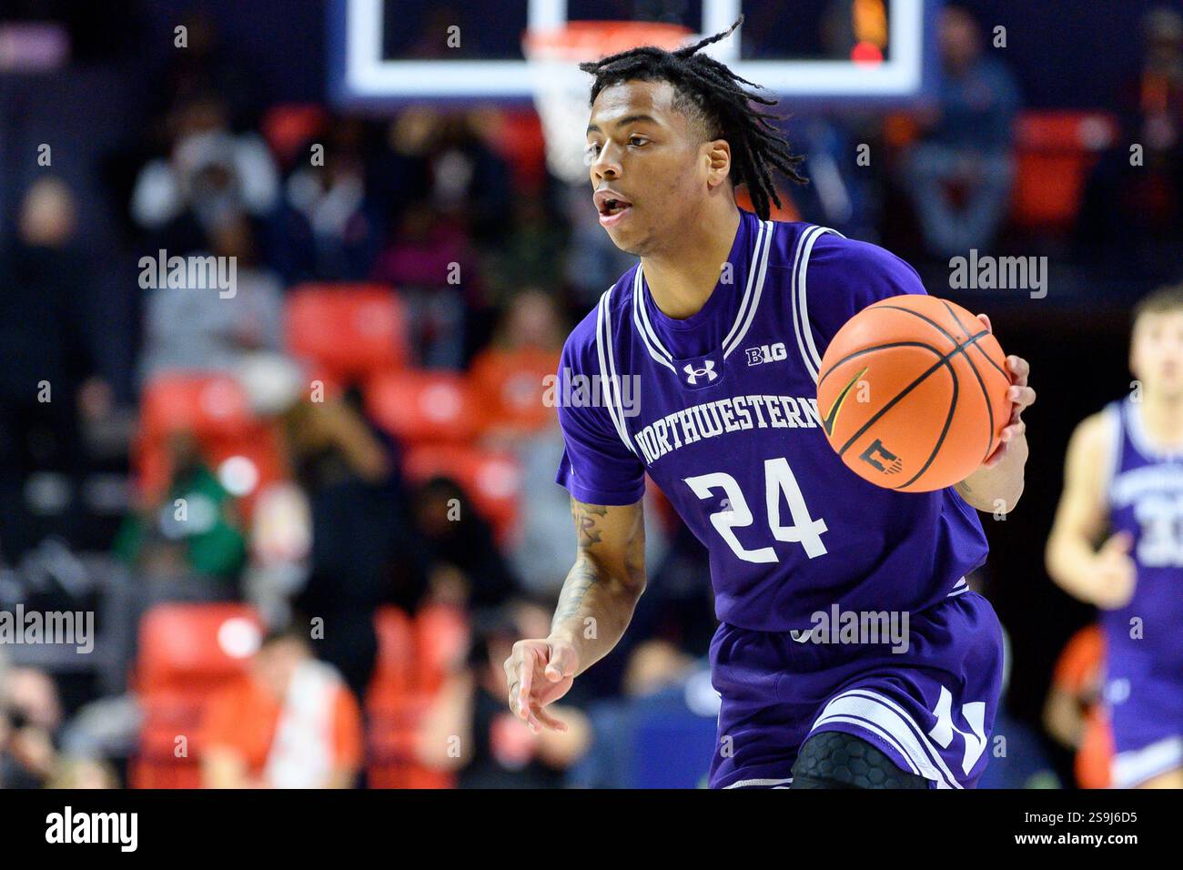 Northwestern's K.J. Windham looks to pass the ball during the second ...