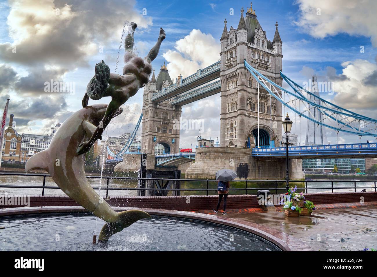 Girl with Dolphin fountain on the north bank of the Thames river, Tower ...