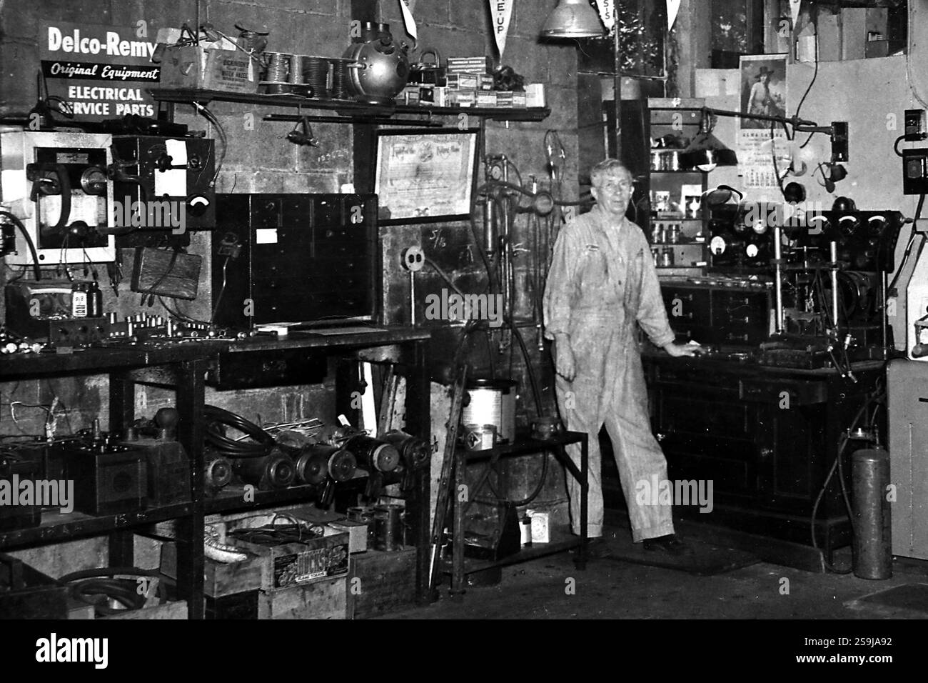A man poses in his garage electronics workshop, circa 1955 Stock Photo ...