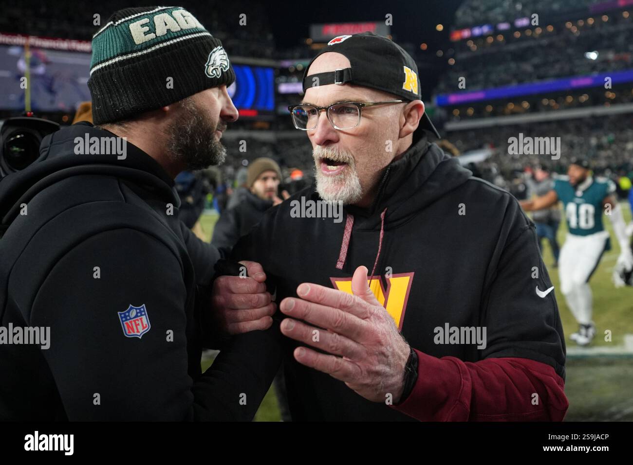 Philadelphia Eagles coach Nick Sirianni, left, shakes hands with ...