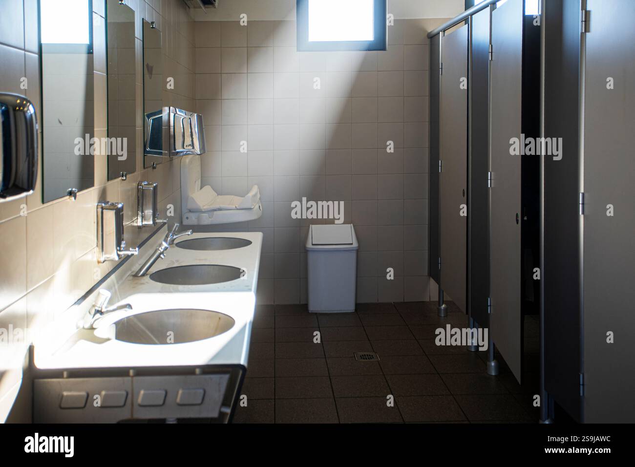 women's public toilet with a changing table for a baby at a gas station ...