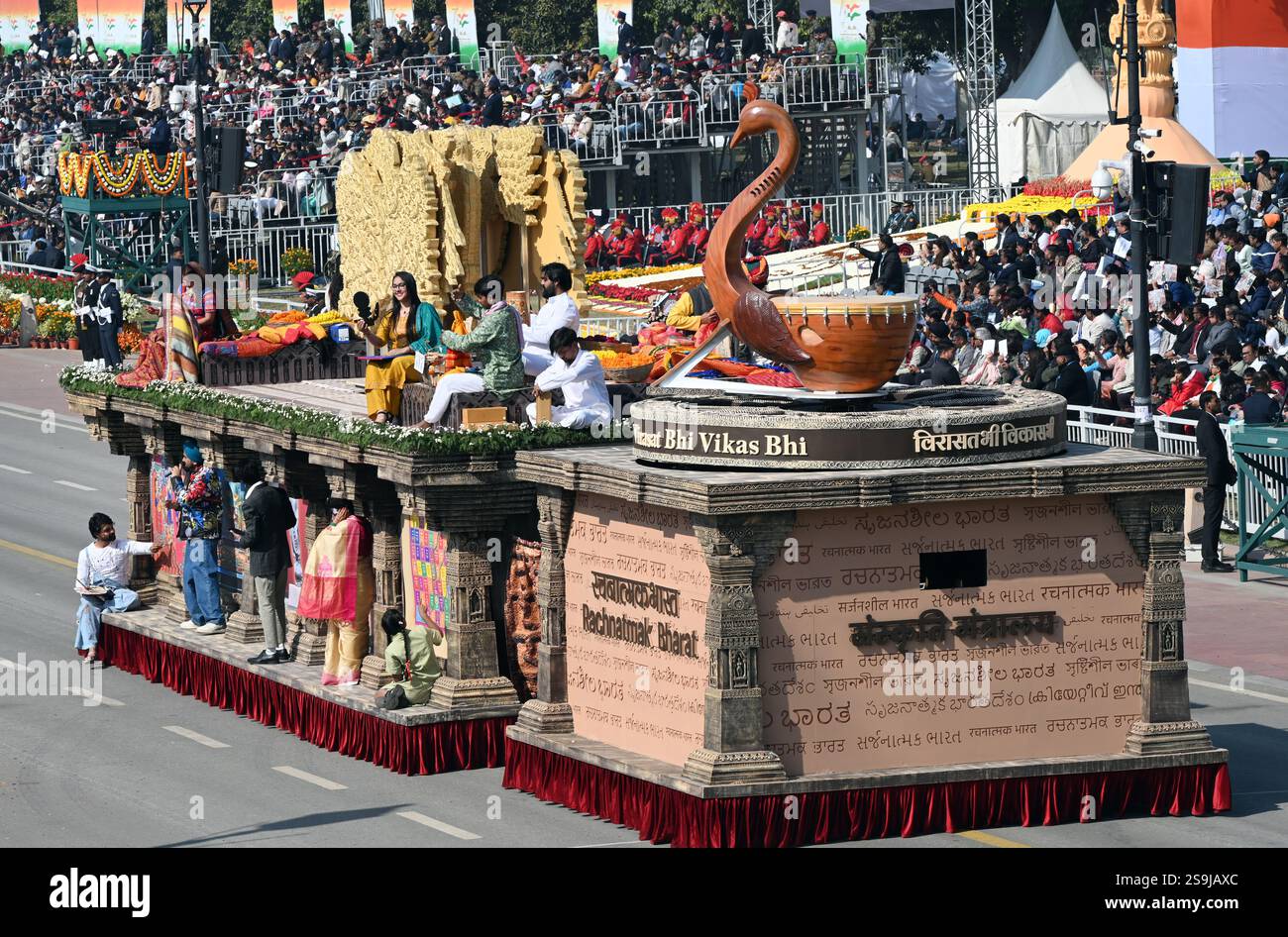 NEW DELHI, INDIA - JANUARY 26: Artists perform beside the tableaux of Ministry of Culture during ...