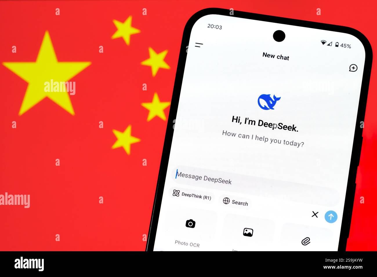 DeepSeek AI app chat seen on the smartphone and blurred Chinese flag on ...