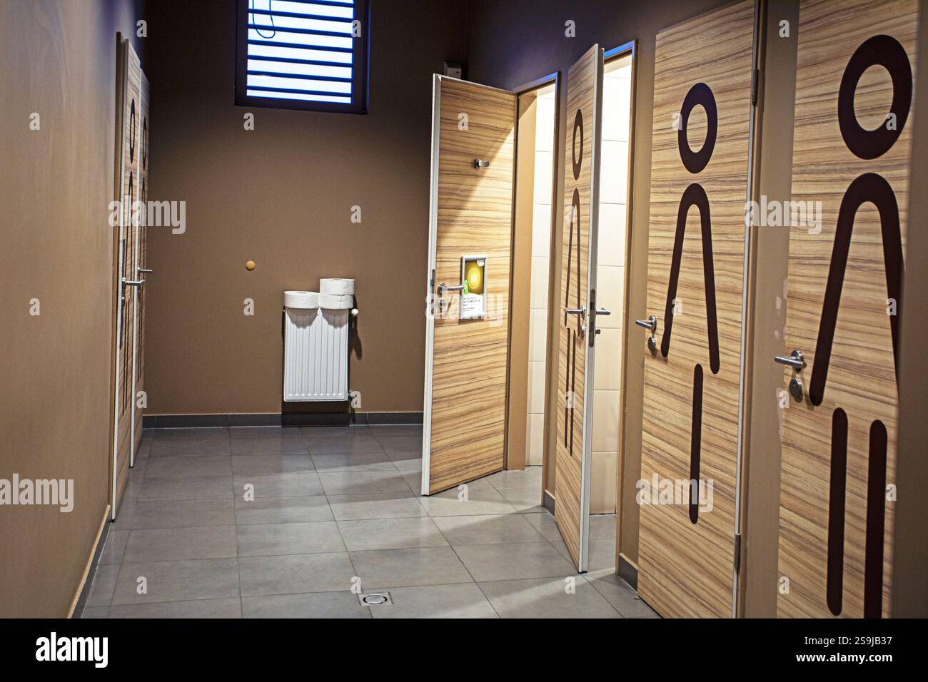 stylish design of women's and men's toilet rooms at a gas station Stock ...