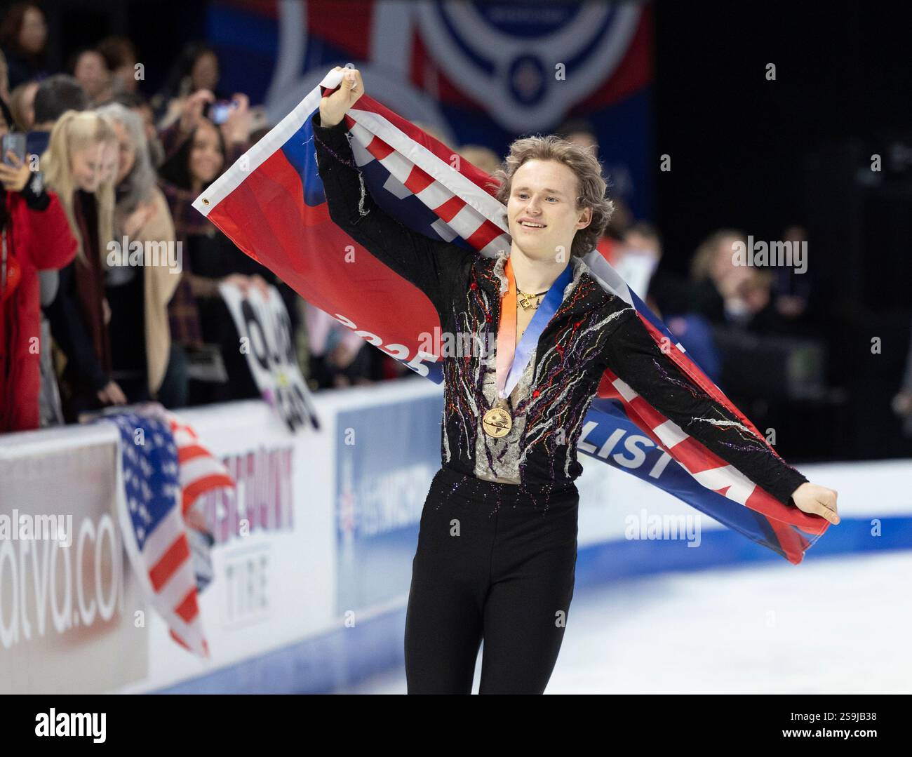 Ilia Malinin takes a lap around the rink after winning the men's ...