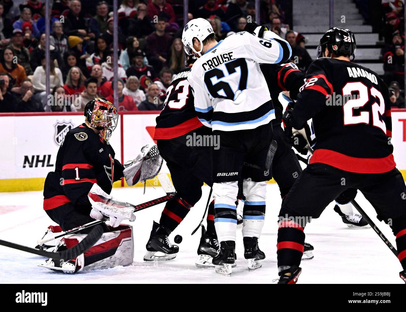 Ottawa Senators goaltender Leevi Merilainen (1) makes a save in front ...