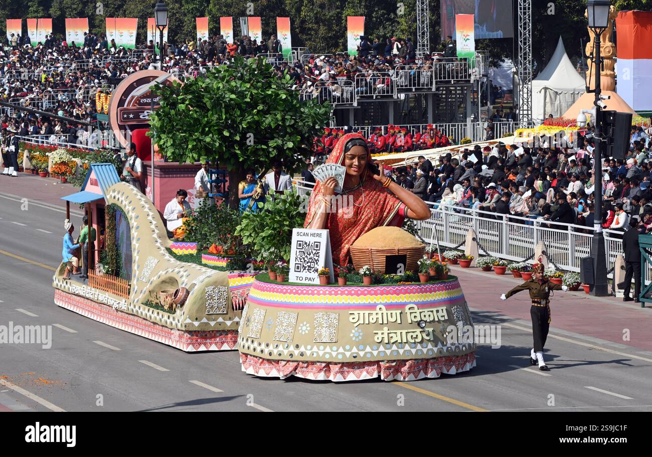 NEW DELHI, INDIA - JANUARY 26: Artists perform beside the tableaux of Ministry of Rural ...