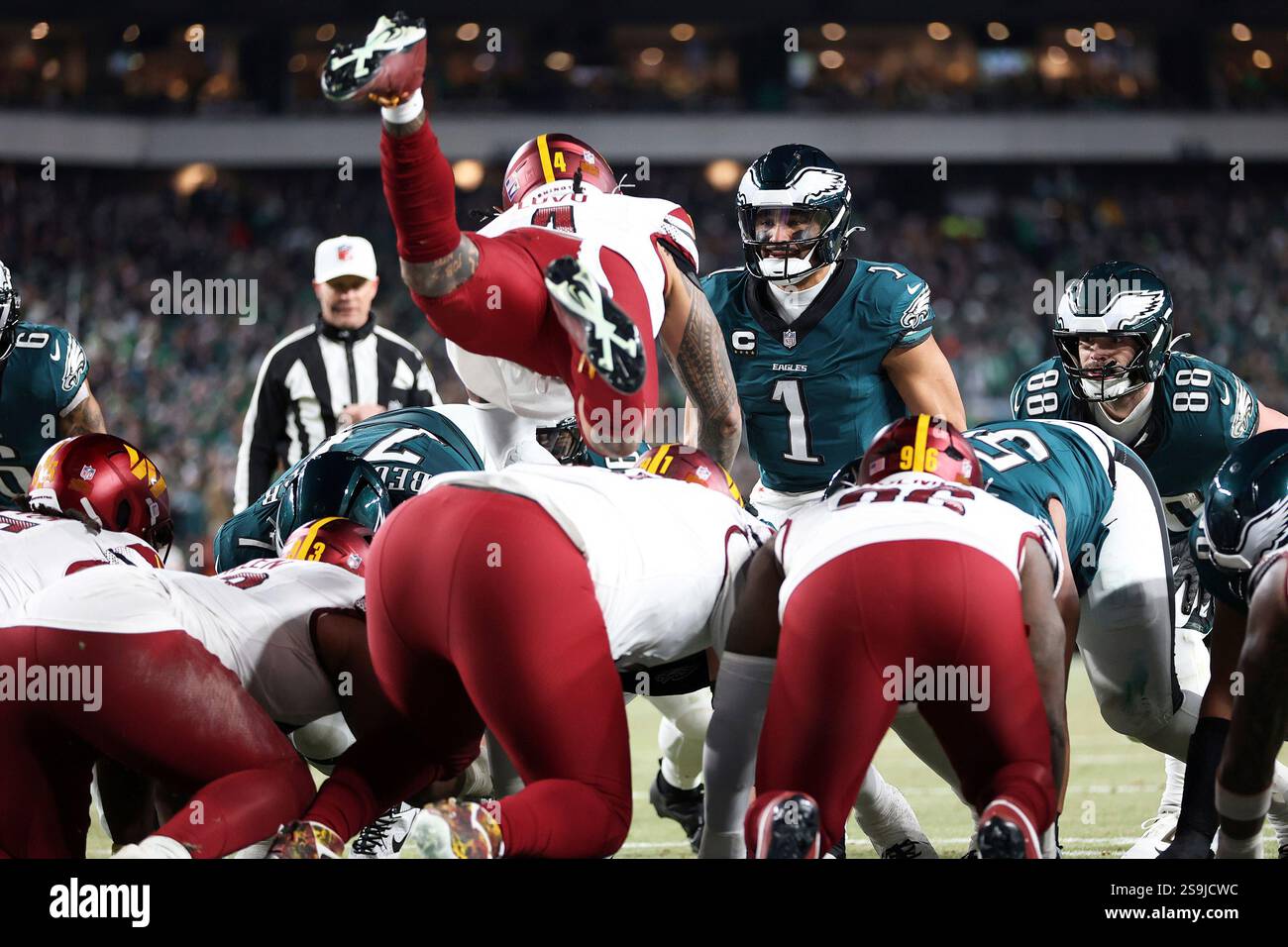 Washington Commanders linebacker Frankie Luvu (4) leaps towards ...