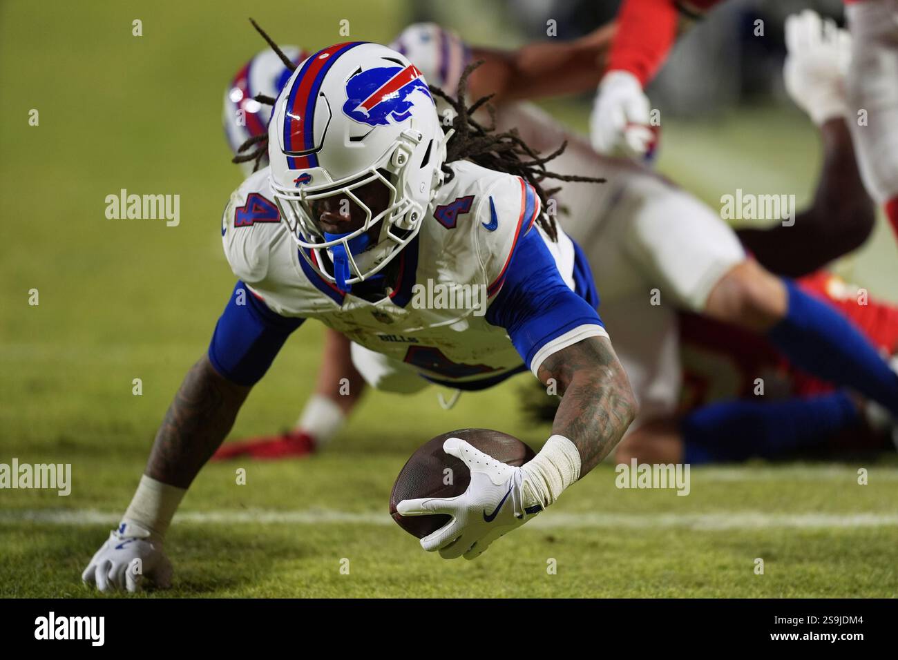 Buffalo Bills running back James Cook (4) scores during the first half ...