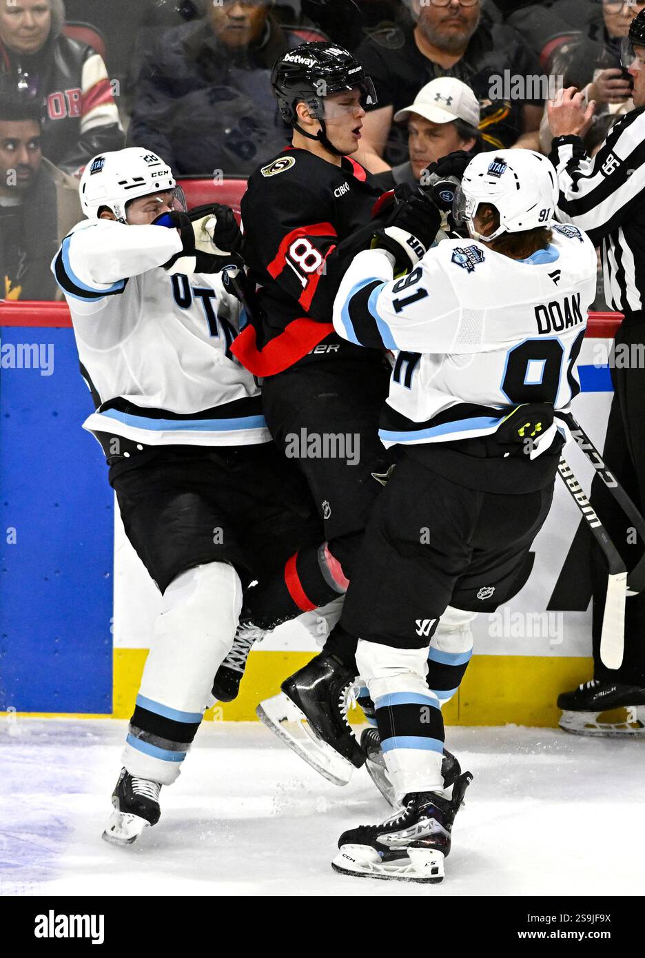 Ottawa Senators' Tim Stutzle (18) is caught between Utah Hockey Club's ...