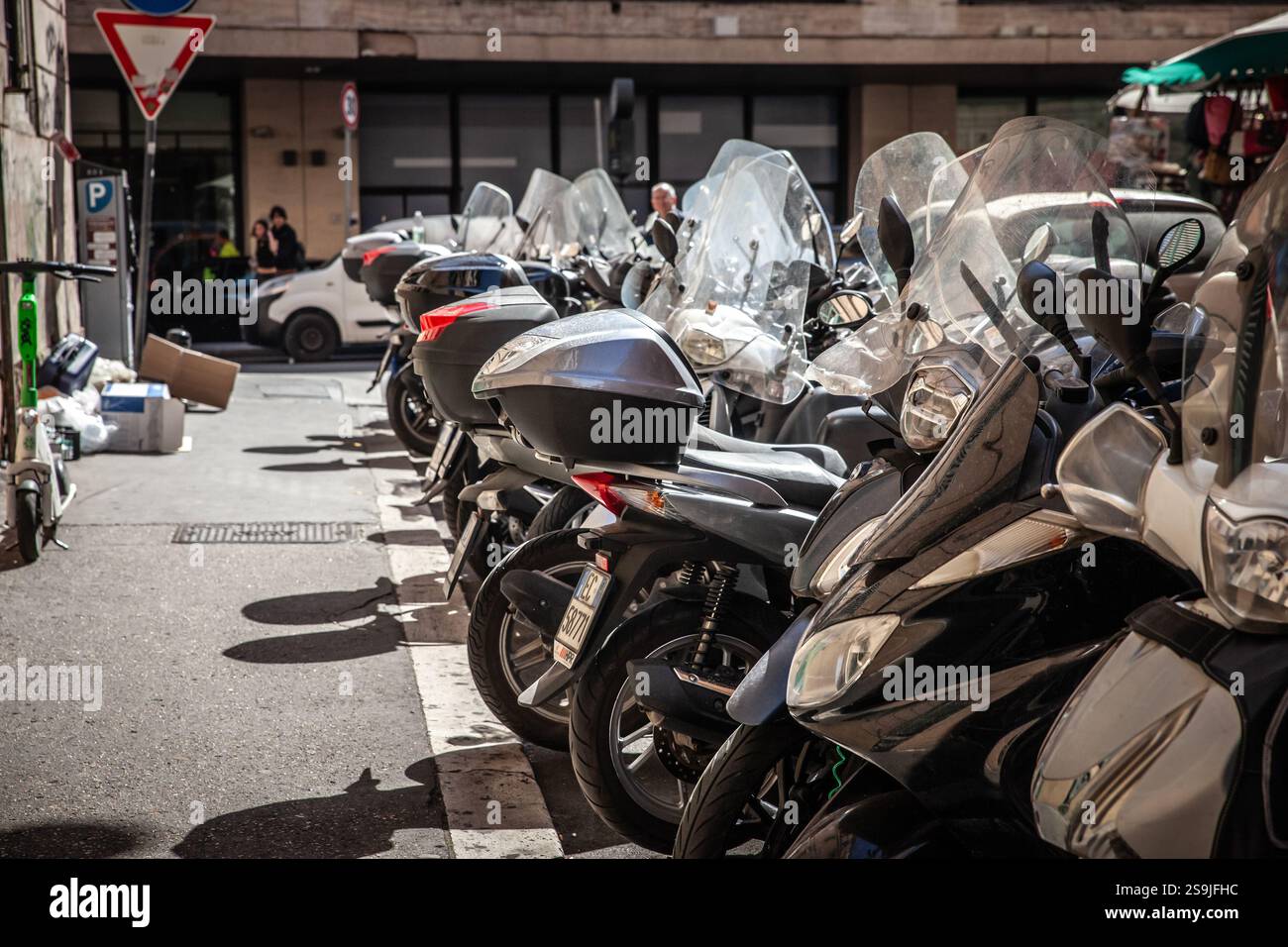 ROME, ITALY - JUNE 15, 2024: A line of scooters in central Rome, Italy ...