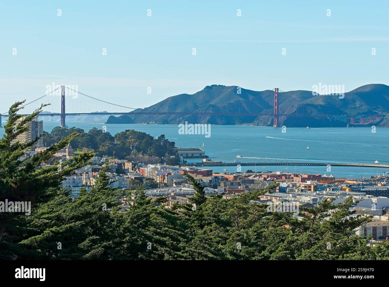 High angle view of San Francisco waterfront with distant Golden Gate ...