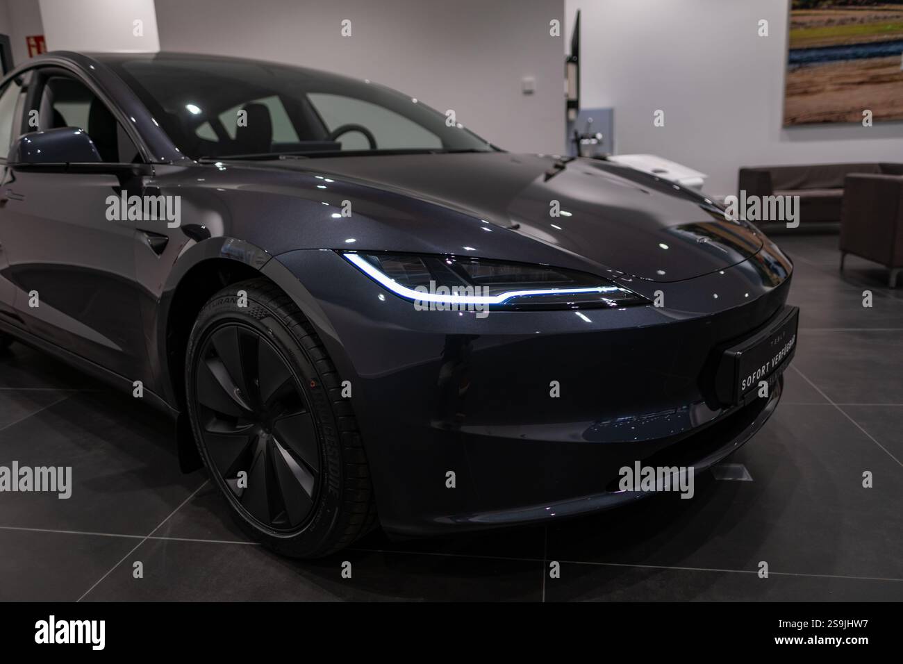 sleek midnight-black Tesla Model 3, futuristic headlights and iconic ...