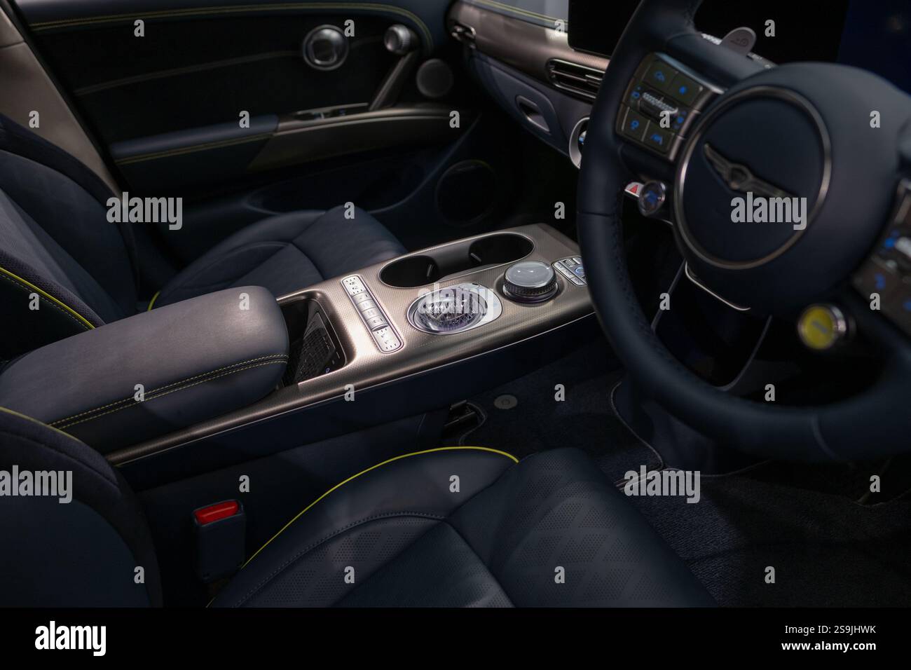 Genesis GV60 car interior, steering wheel, driver seating, dashboard ...