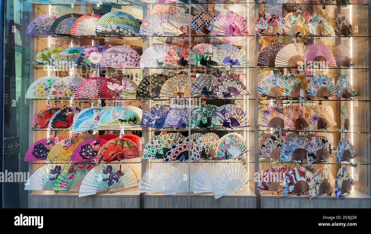 A shop display in Seville featuring various types of hand fans with ...