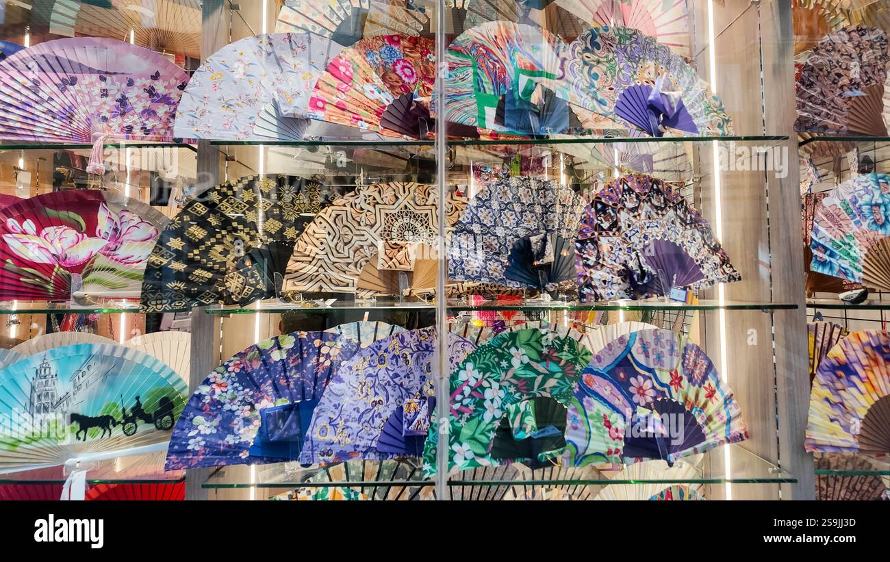 A shop display in Seville featuring various types of hand fans with ...