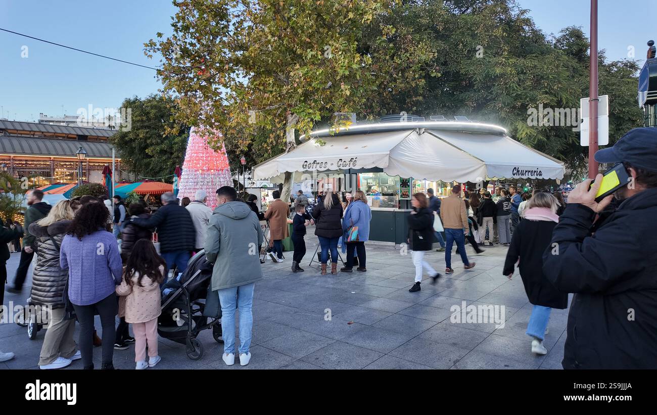 Crowded outdoor cafe or kiosk in Seville during the evening Stock Photo ...