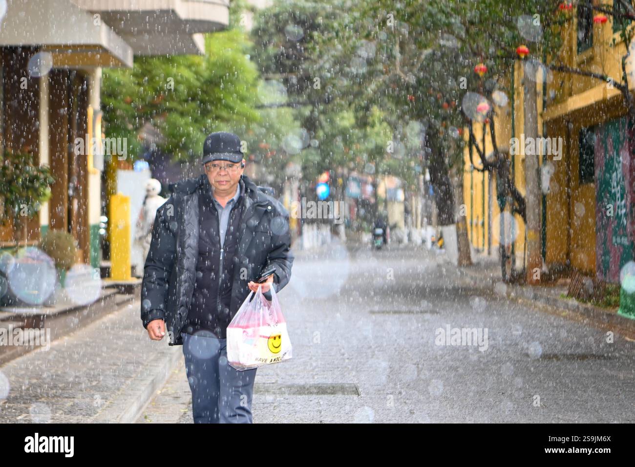 **CHINESE MAINLAND, HONG KONG, MACAU AND TAIWAN OUT** People walk in ...