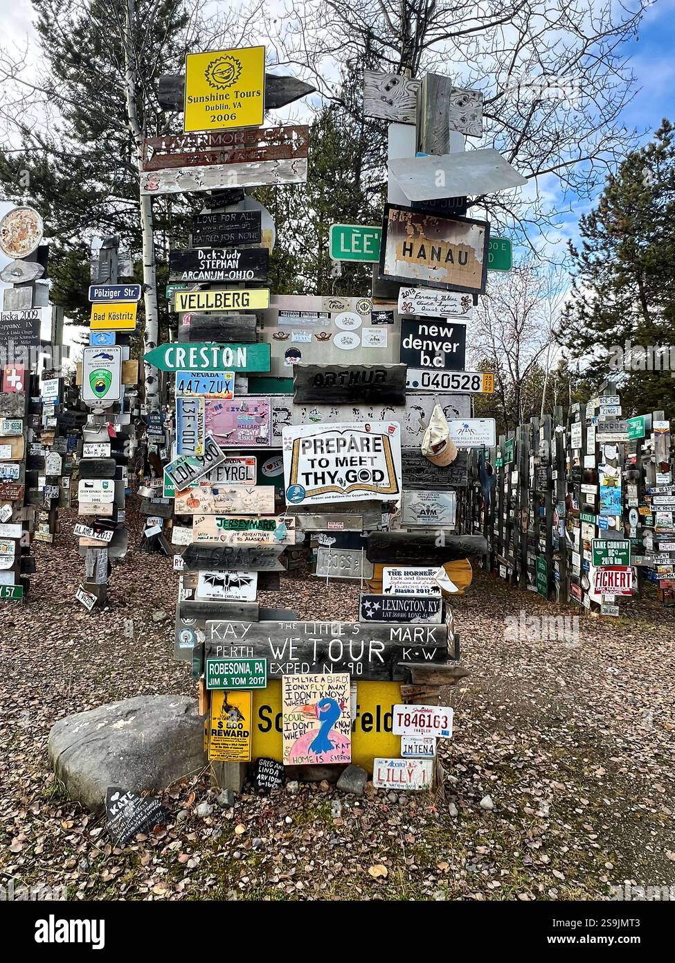 Watson Lake, Canada - October 9, 2024: Paths through signs and license ...