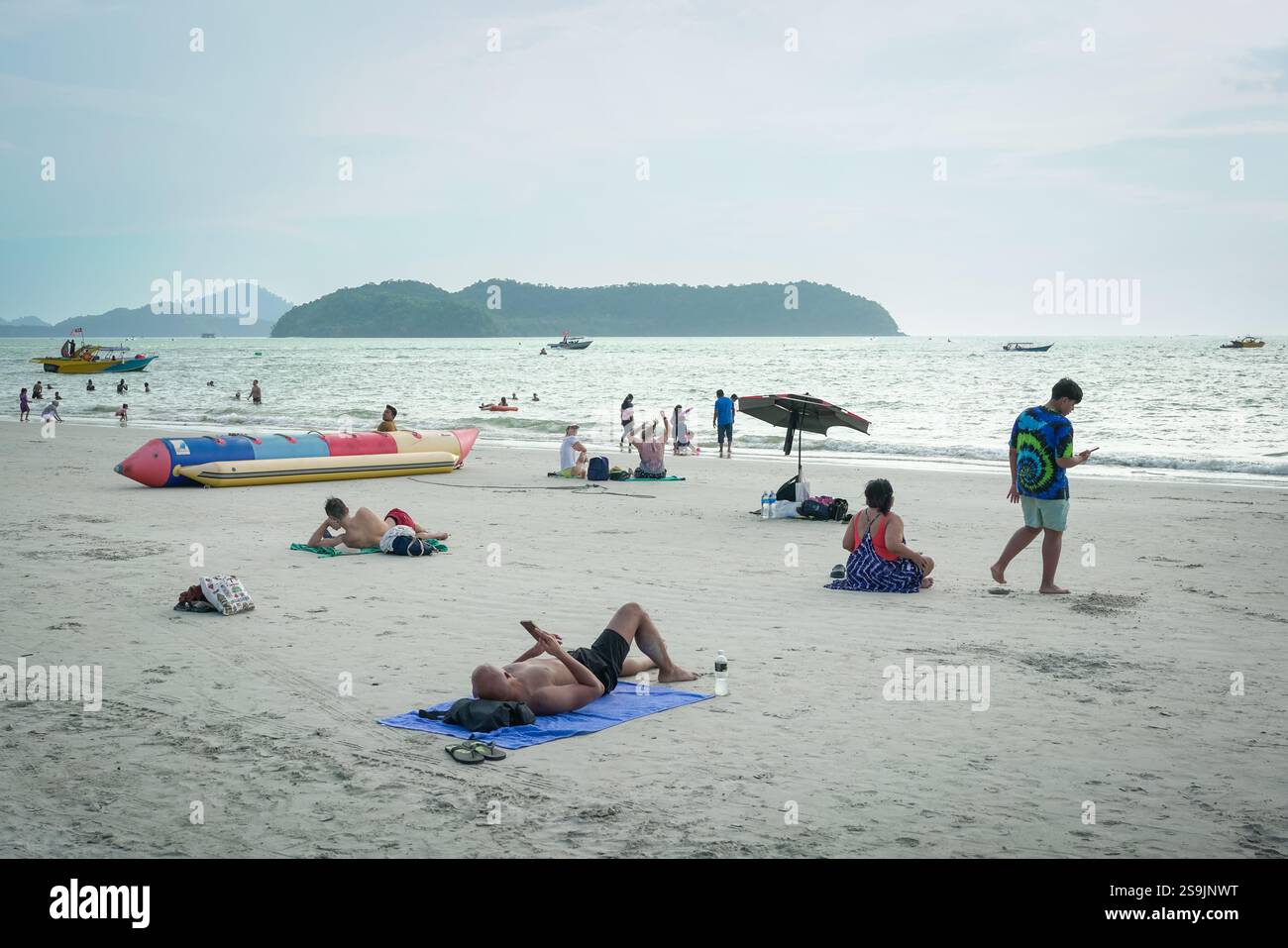 Langkawi, Malaysia - January 3, 2025: Tourists relaxing at the ...