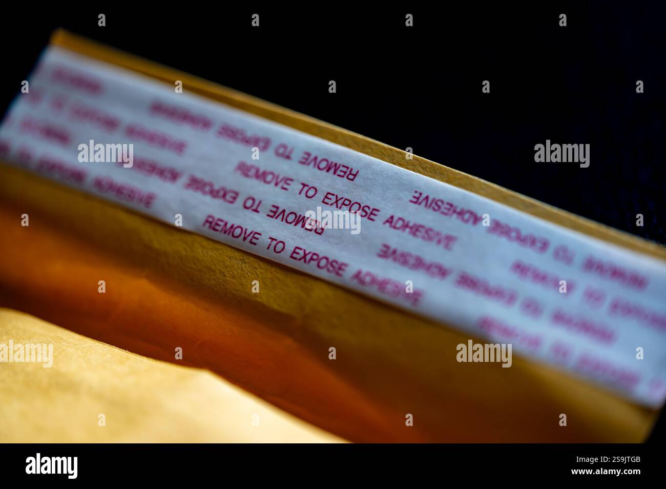 Selective focus on the adhesive strip of a mail envelope Stock Photo ...