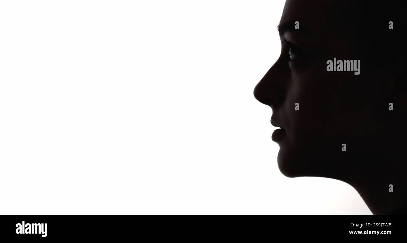 Faithful face. Anxious hope. Dark contrast profile silhouette of ...