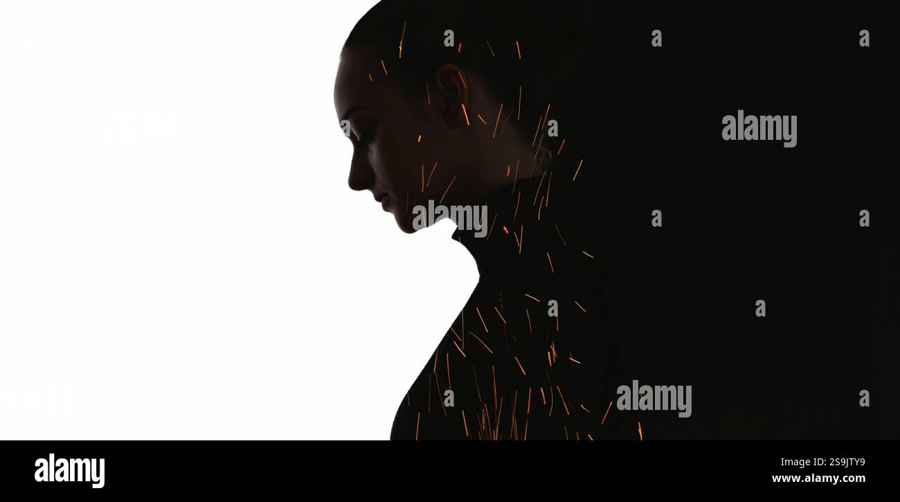 Anxious silhouette. Emotional burnout. Fire sparks in dark double ...