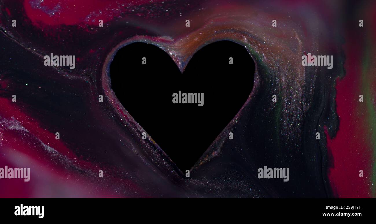 Sparkling heart. Shimmering liquid. Defocused dark red multicolor black ...
