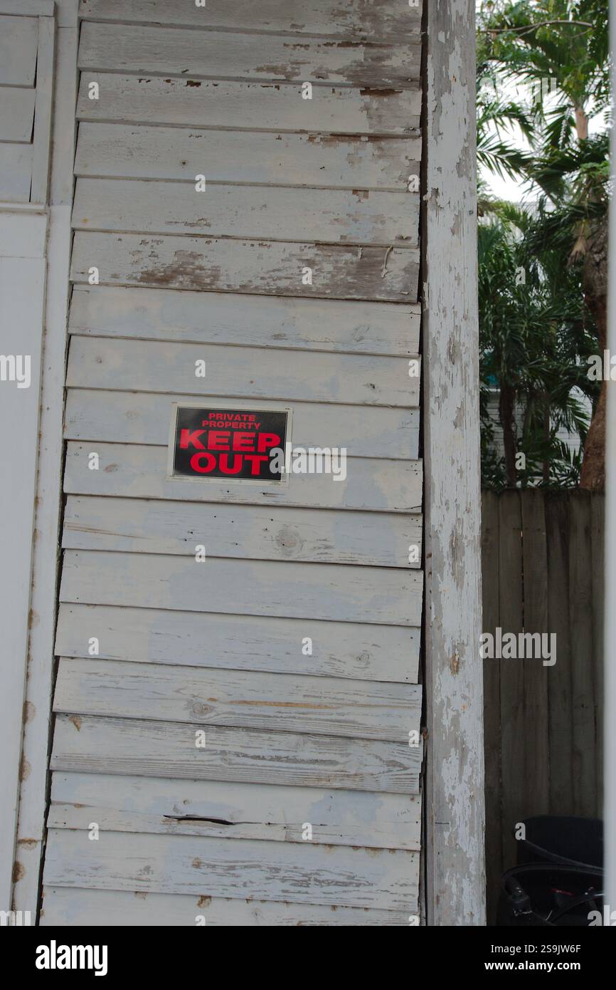 Sign posted on an old weathered house With the copy Private Property ...